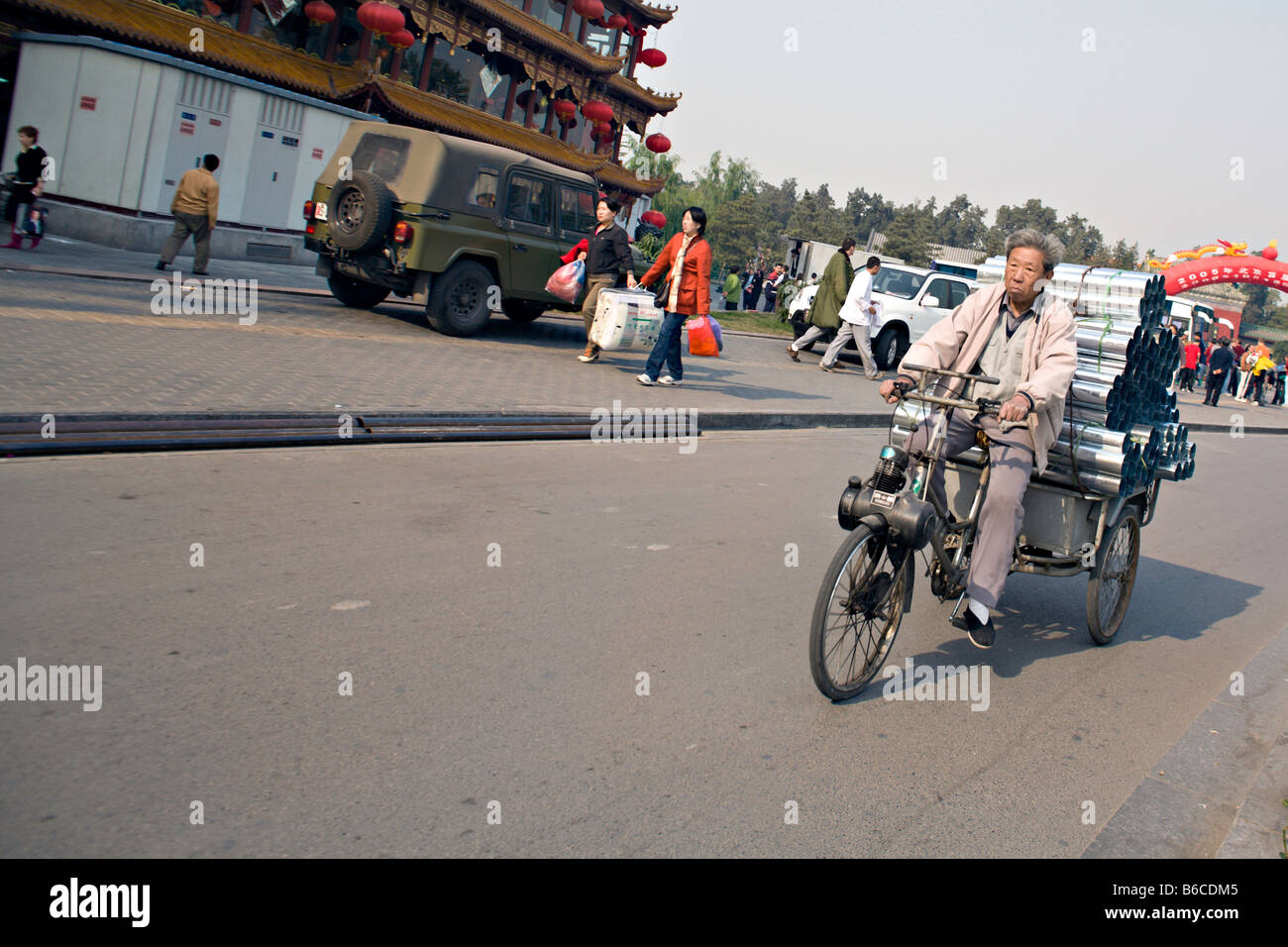 CHINA BEIJING Older Chinese man uses a three wheeled bicycle to deliver ...
