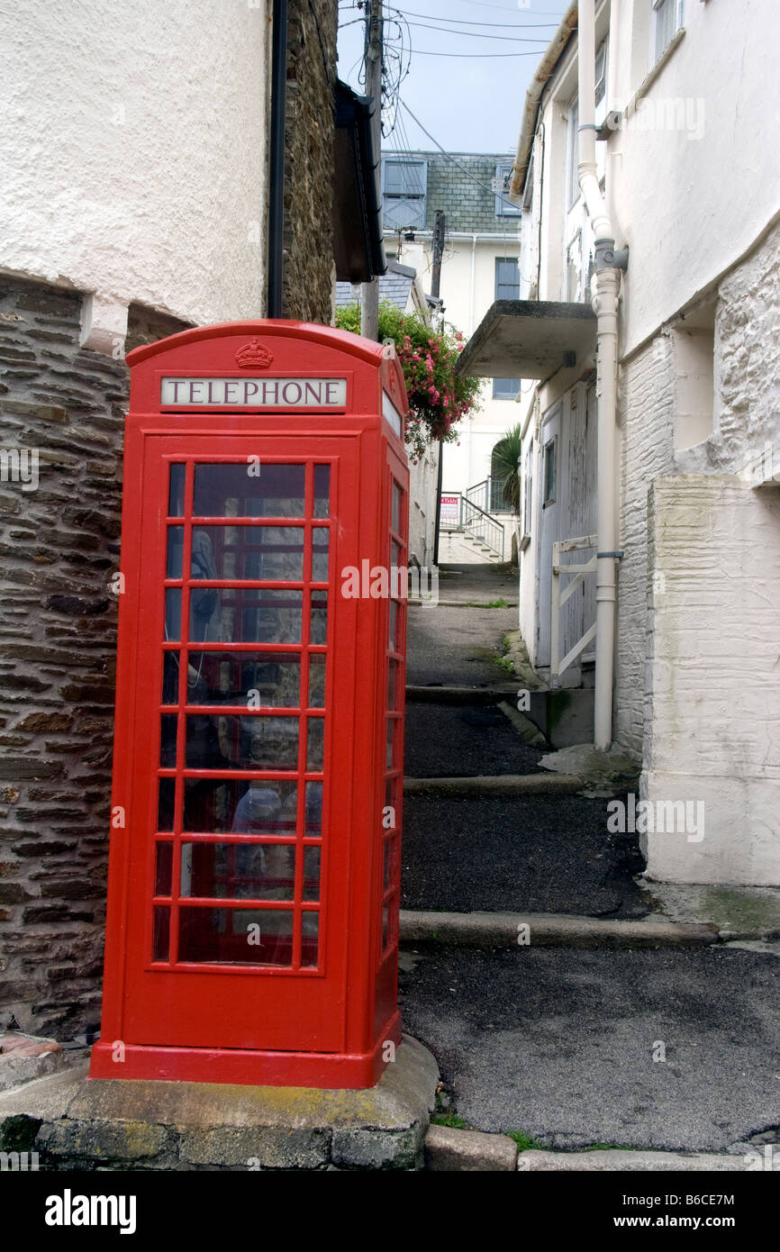 Red telephone box between buildings in St Mawes, Cornwall, England ...