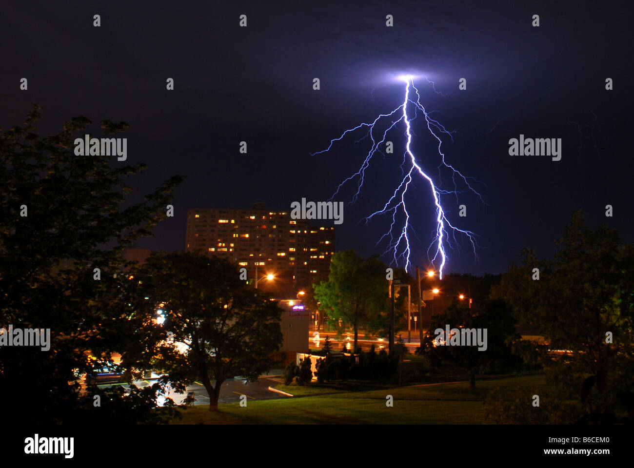 Lightning bolt strikes the ground in an urban environment Stock Photo ...