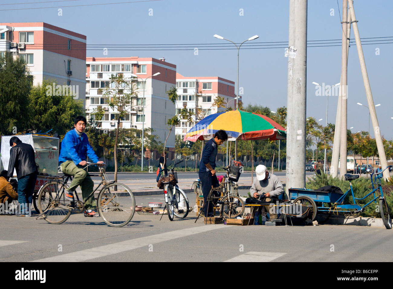 CHINA BEIJING Busy intersection in downtown Beijing with bicycle ...