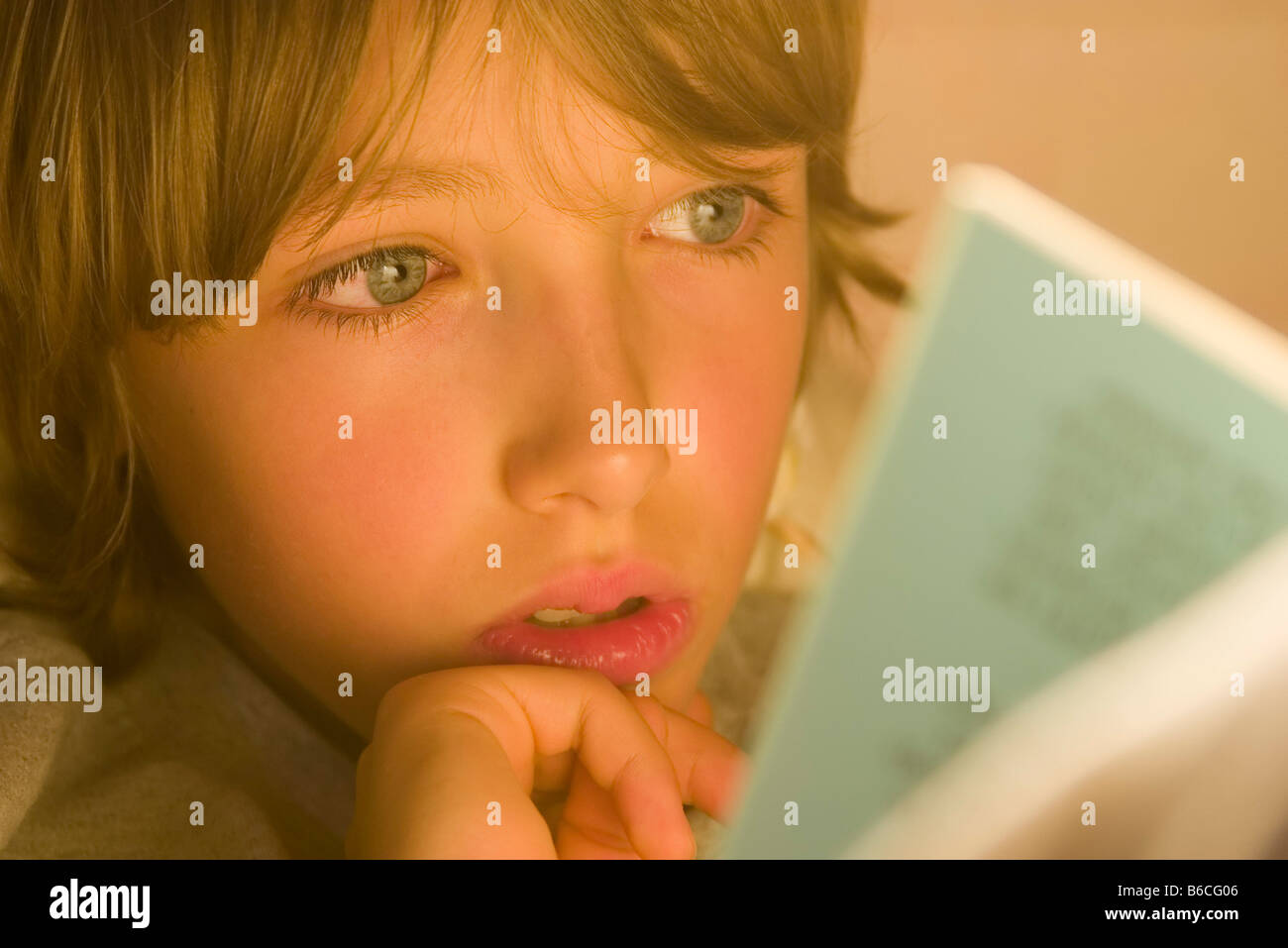 Close-up of boy reading book Stock Photo - Alamy