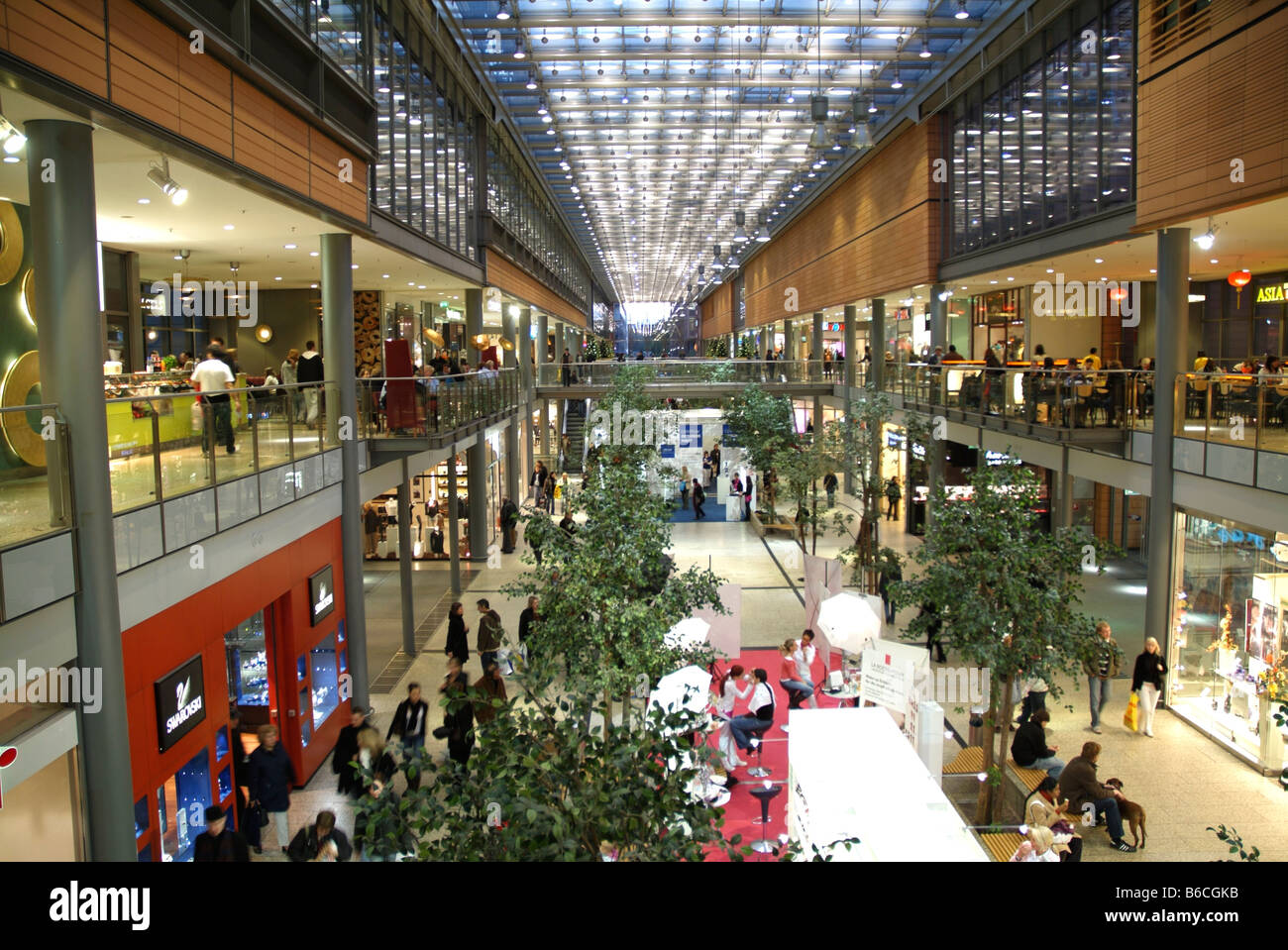People in shopping mall Stock Photo - Alamy