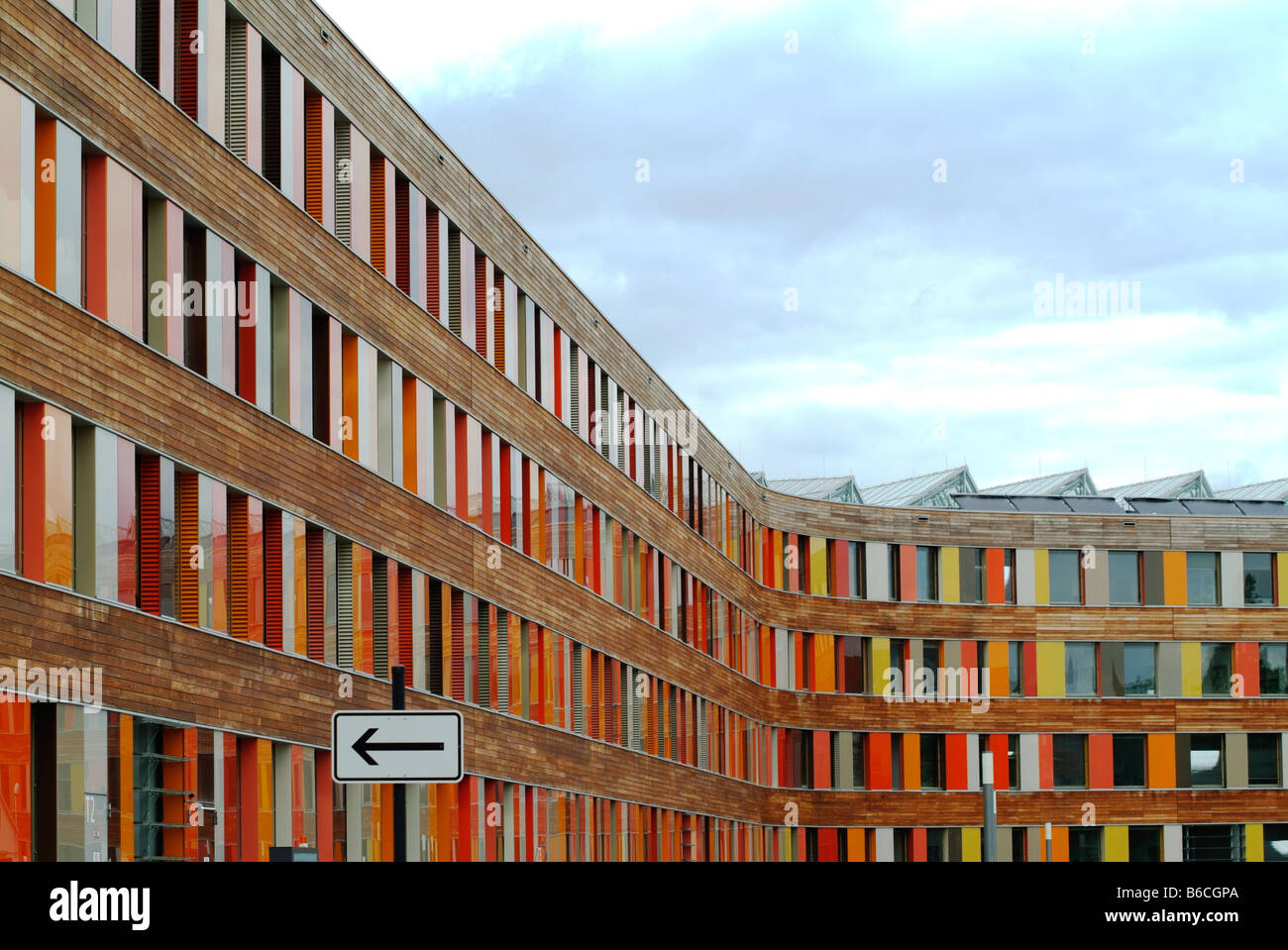 Arrow sign in front of building Stock Photo - Alamy