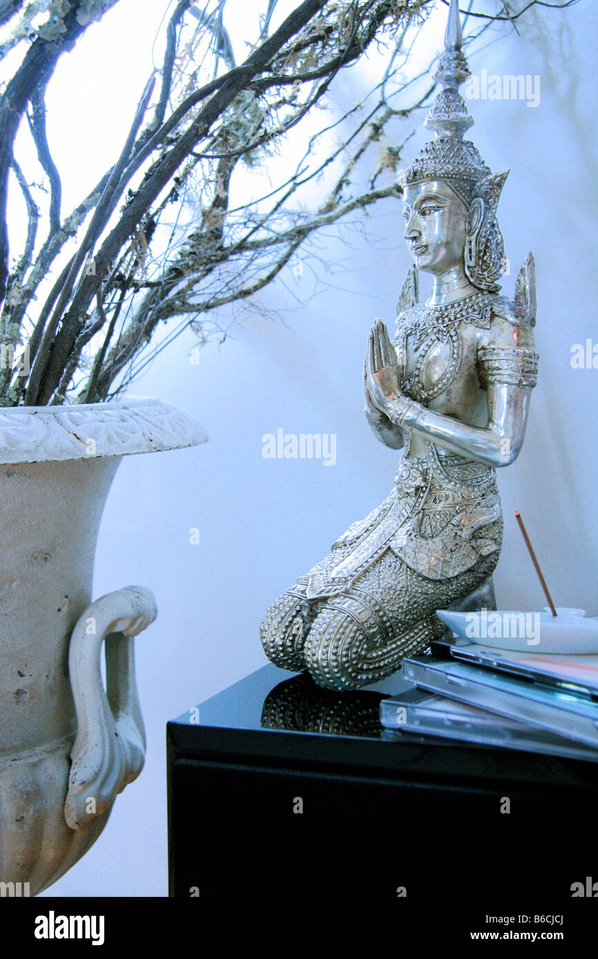 Close-up of praying sculpture on table Stock Photo - Alamy