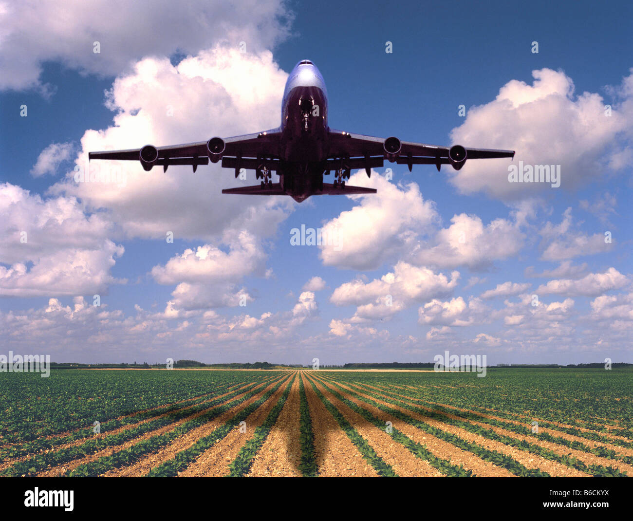 Airplane flying over agricultural field hi-res stock photography and ...