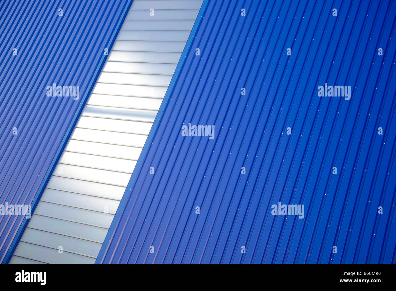 Windows on blue wall of storehouse Stock Photo - Alamy