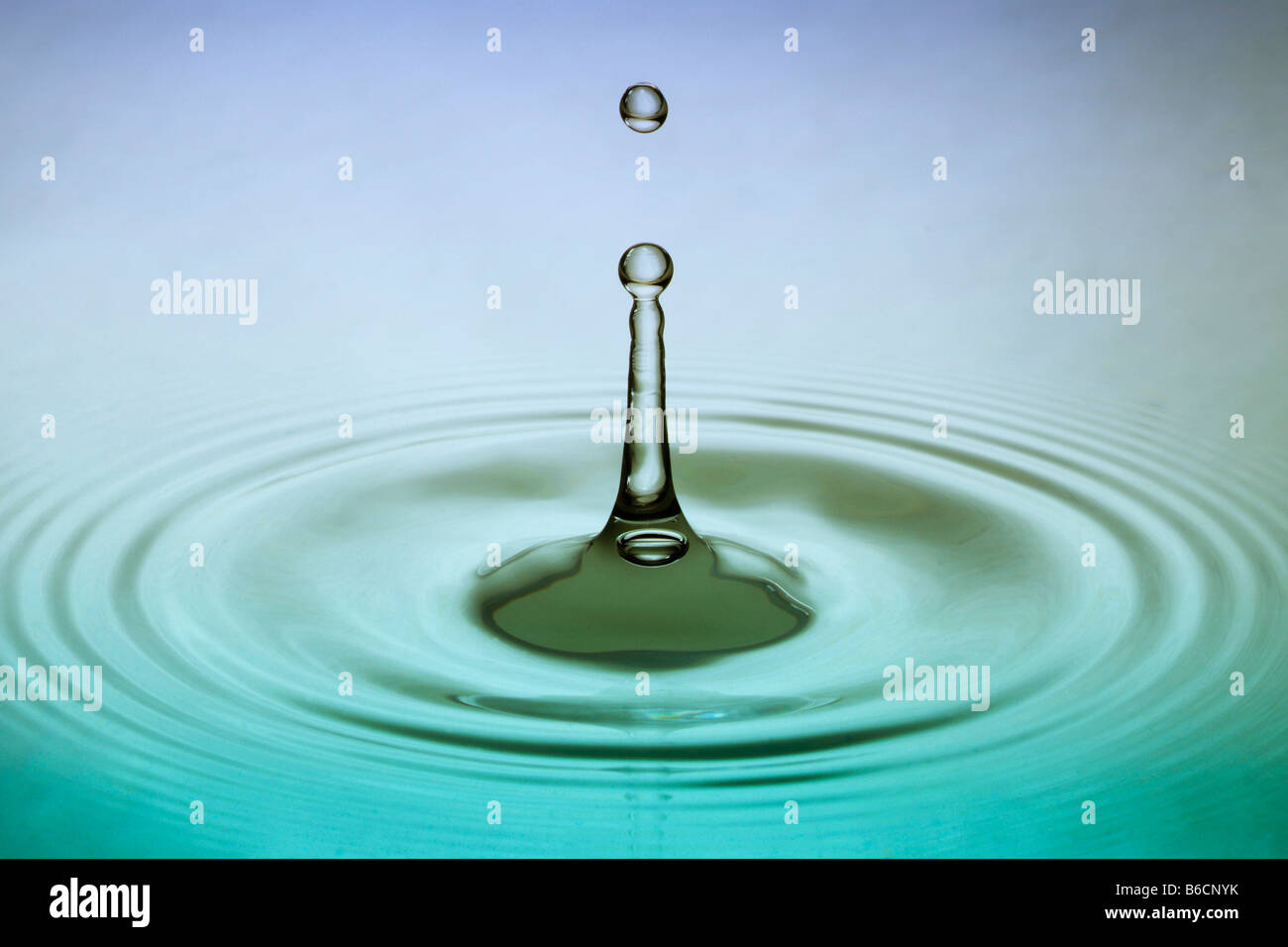 Close-up of water droplets creating ripples on water surface Stock ...