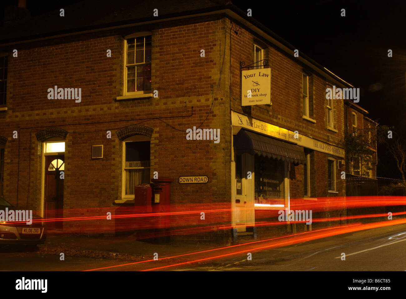 Corner Shop with Traffic Trails Stock Photo - Alamy