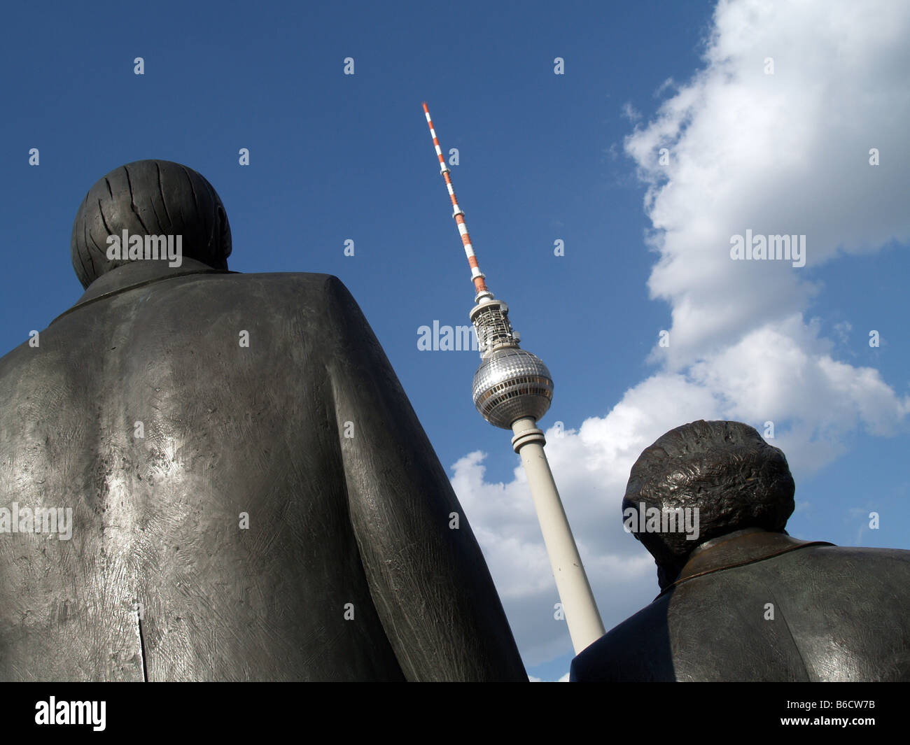 Close-up of Marx-Engels monument with tv tower in background ...