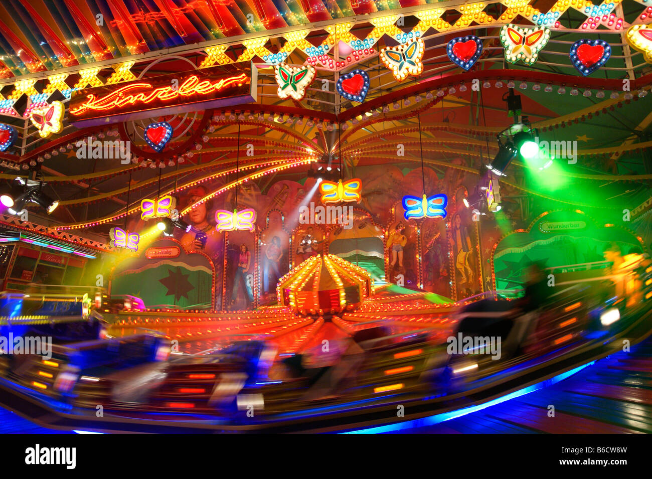 Amusement ride lit up at fair Stock Photo - Alamy