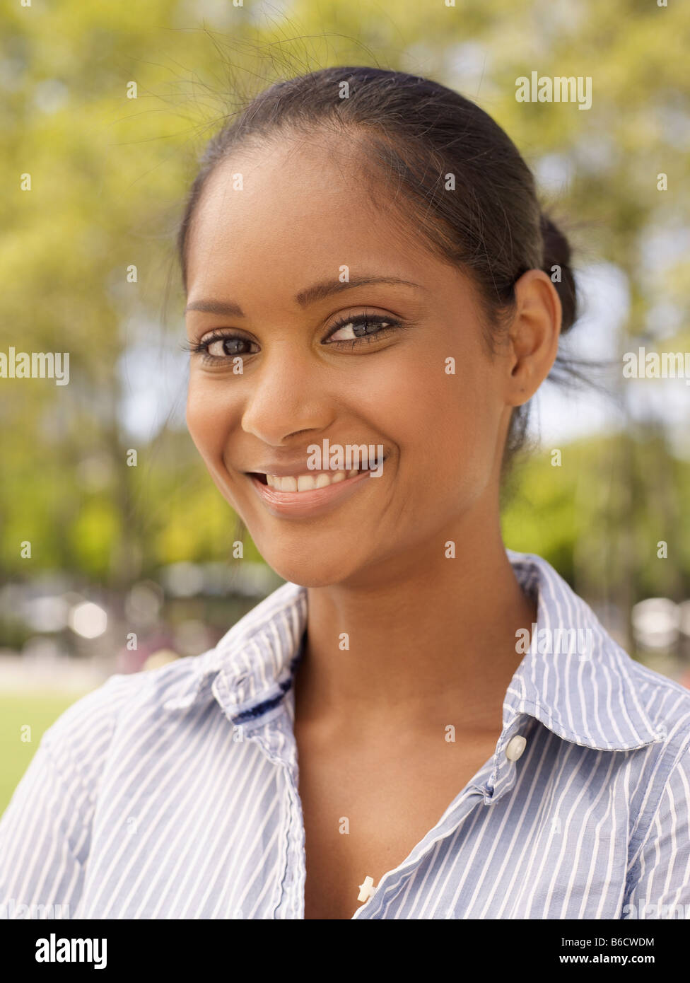Close up of smiling mixed race woman Stock Photo - Alamy