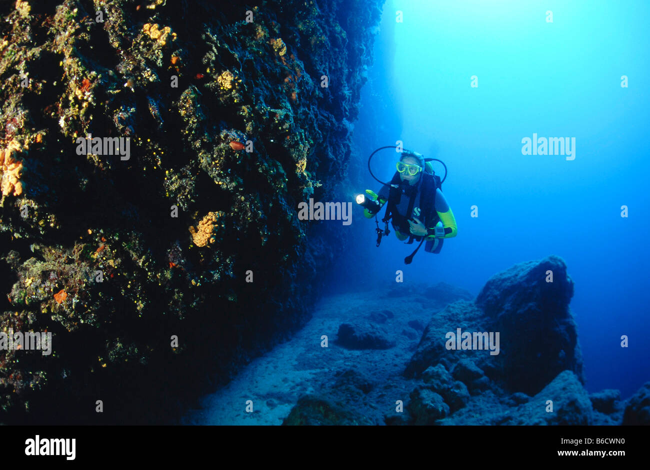 Scuba diver exploring under the sea, Grotto Cave, Corfu Island, Greece ...