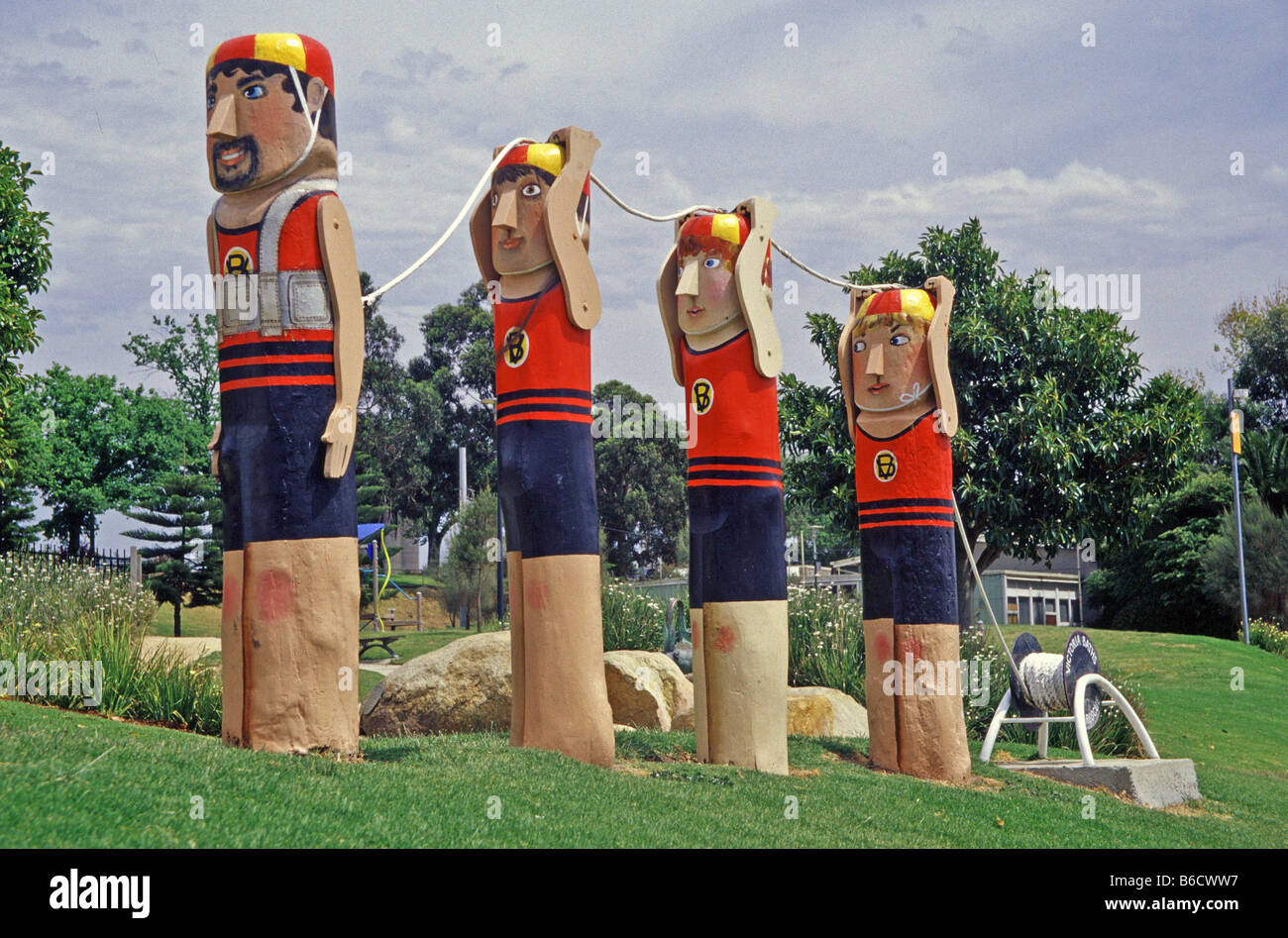 Wooden figurines with rope Stock Photo - Alamy