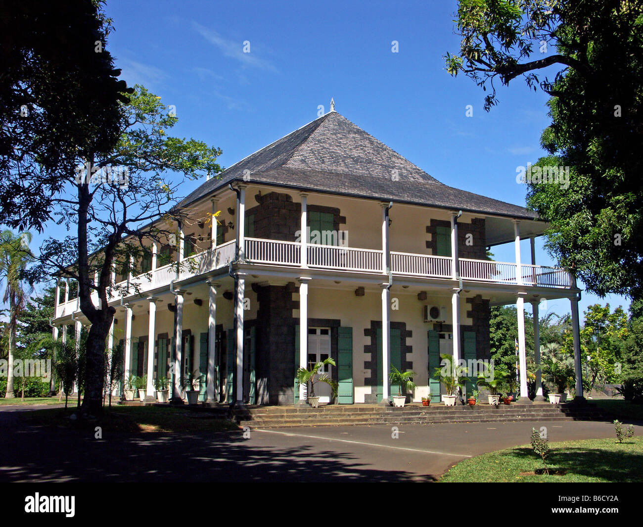 Building in forest surrounded by trees Stock Photo - Alamy