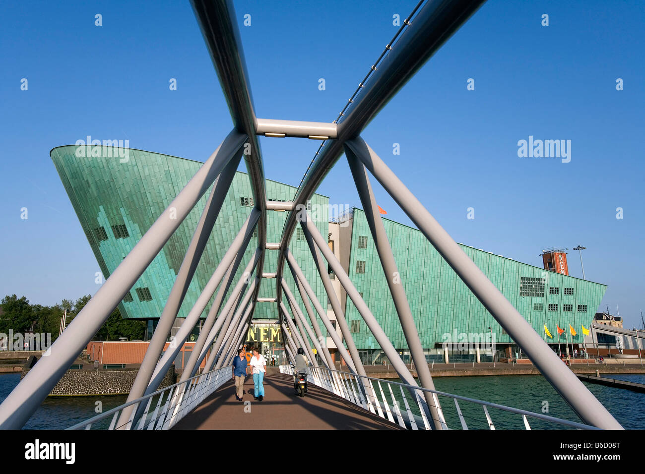 People walking on footbridge, Oosterdock, Amsterdam, Netherlands Stock ...
