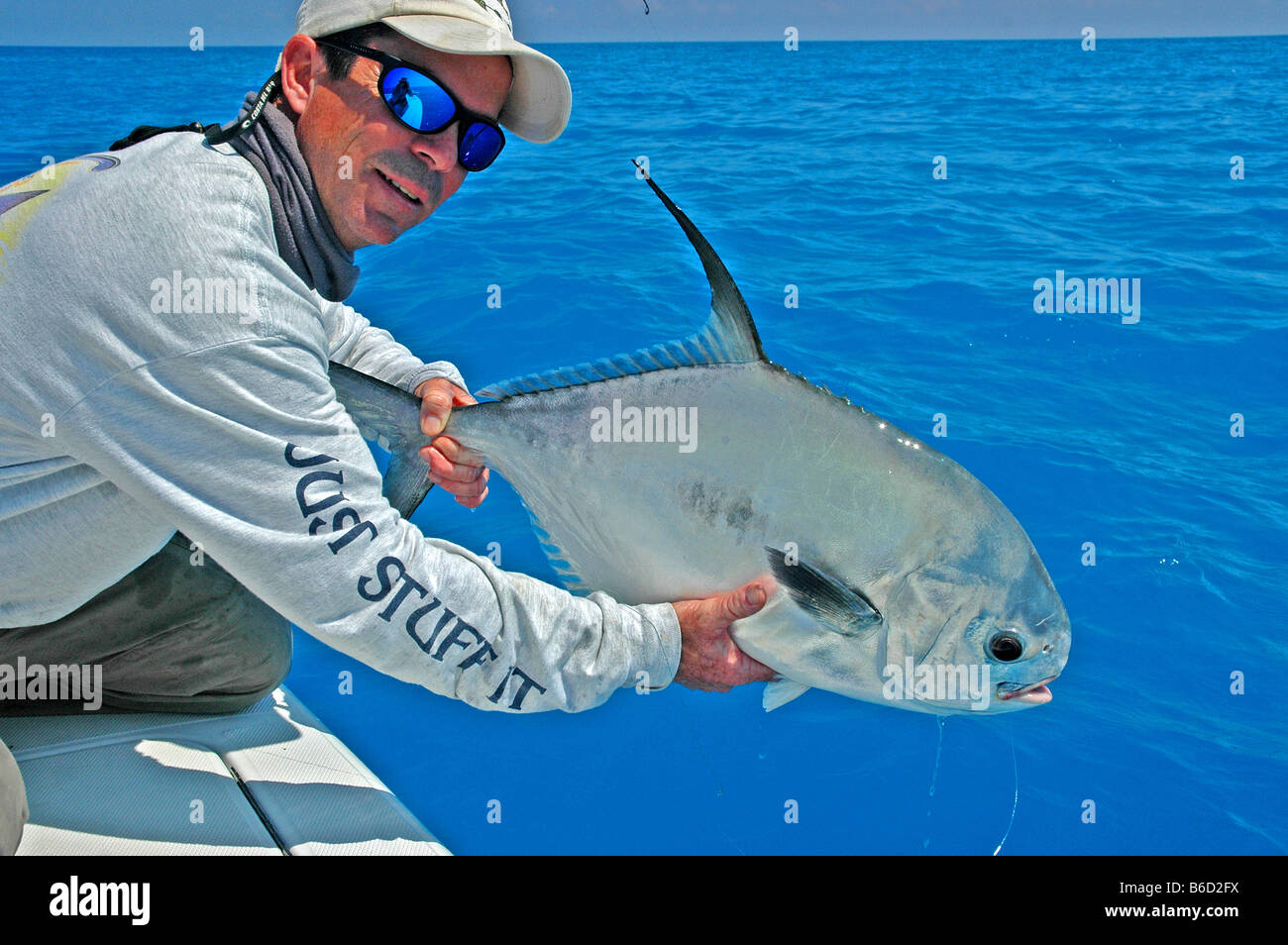 A Florida Keys guide releases a large permit that was caught fishing ...