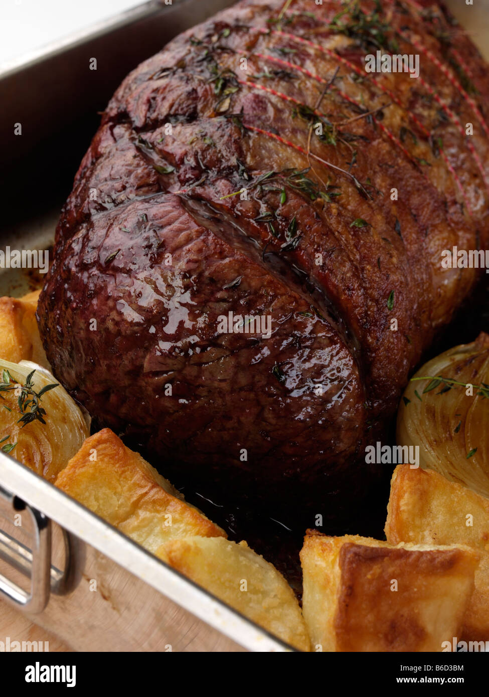 Roast silverside beef joint roast potatoes roasting pan hi-res stock ...