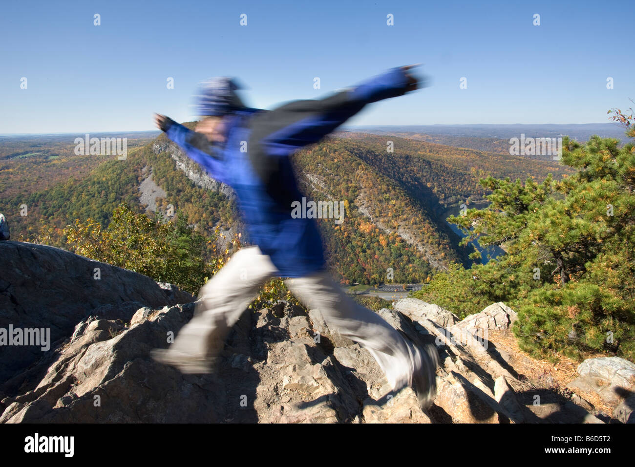 HIKER JUMPS AT OVERLOOK FALL FOLIAGE MOUNT MINSI FROM MOUNT TAMMANY ...