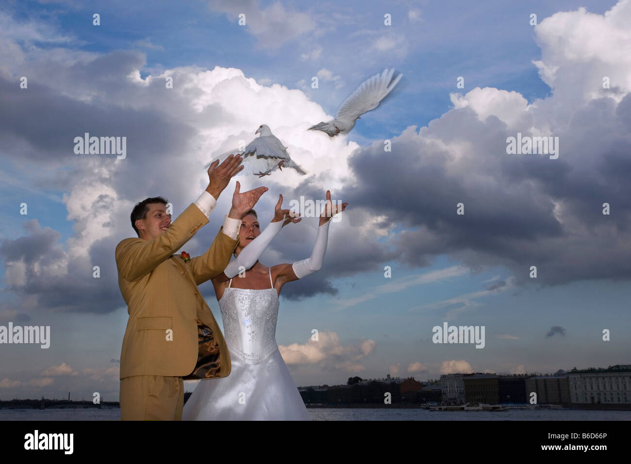 Two white pigeons flying hi-res stock photography and images - Alamy