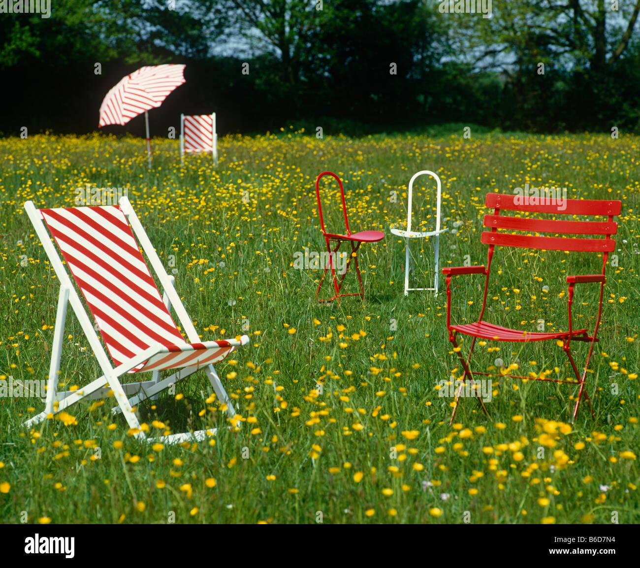 Garden Furniture or Chairs, with an Umbrella/Parasol in the background ...