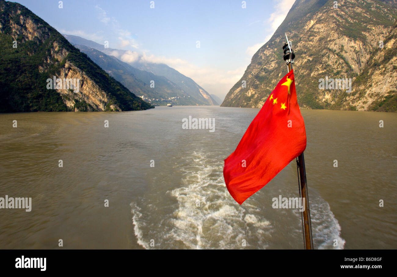 CHINA, YANGTZE RIVER GORGE: Bright red five starred flag of the Peoples ...