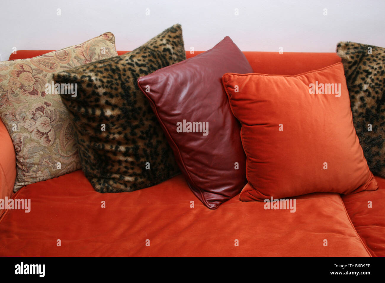 Cushions of various colours on a sofa Stock Photo - Alamy