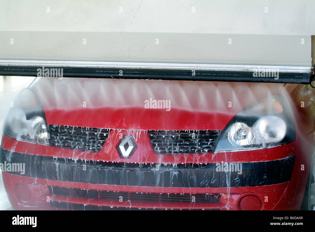 Detail of car wash spray jets with fan of water Stock Photo - Alamy
