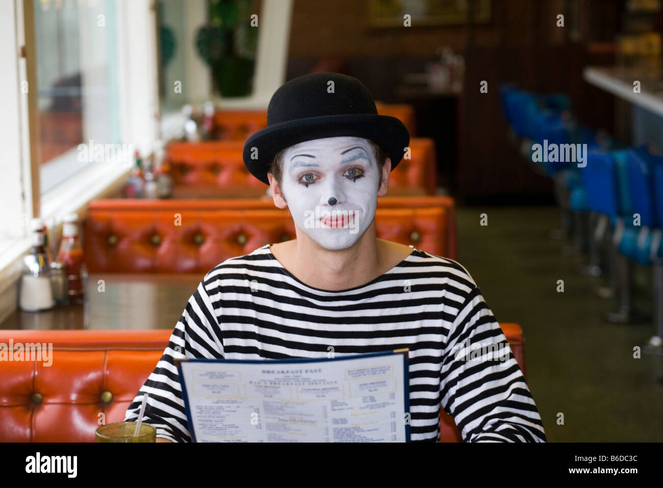 Young man, painted face, mime, smiling Stock Photo - Alamy