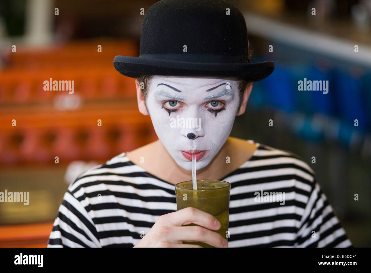 Young man, painted face, mime, smiling Stock Photo - Alamy
