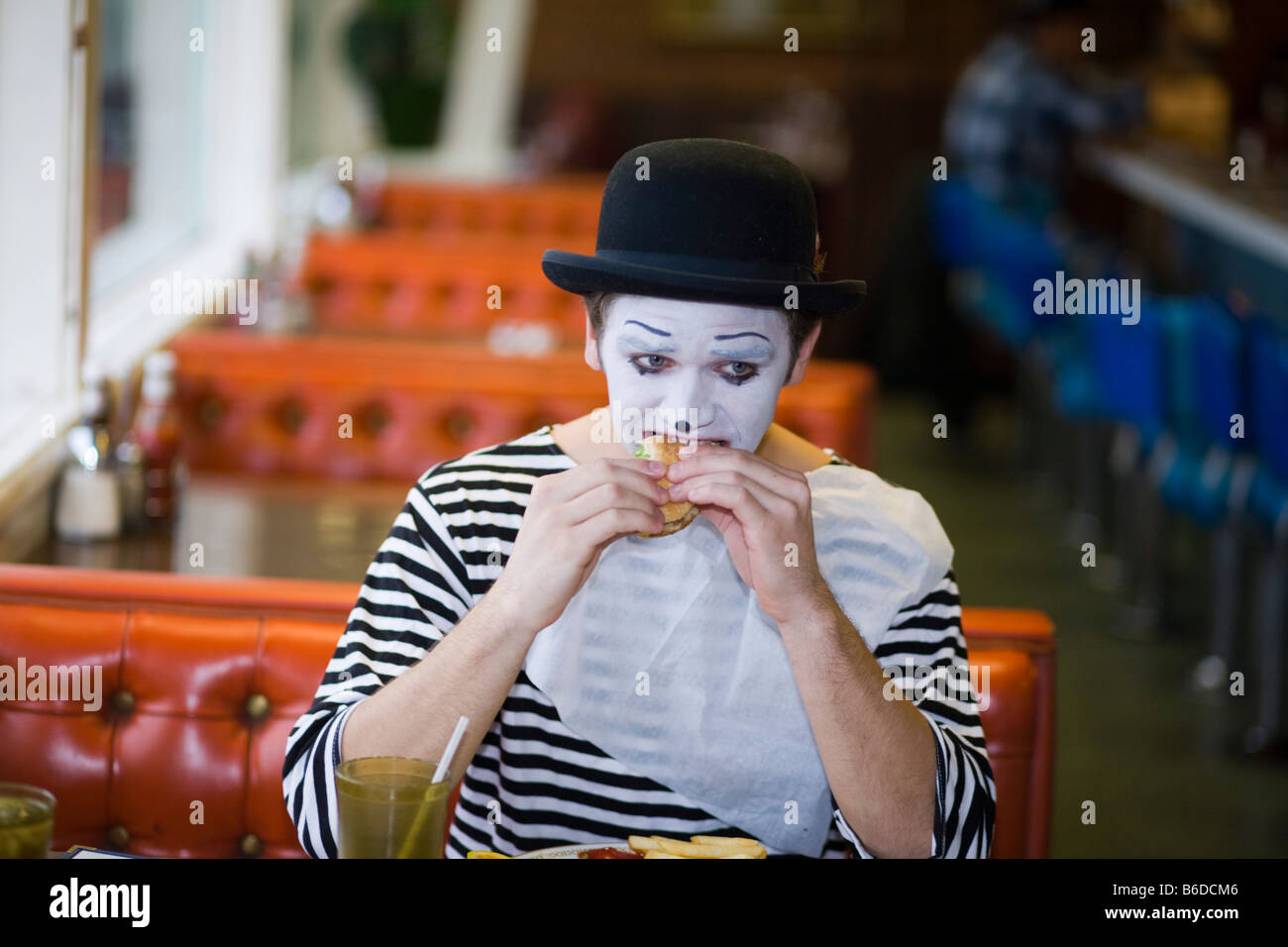 Young man, painted face, mime, smiling Stock Photo - Alamy