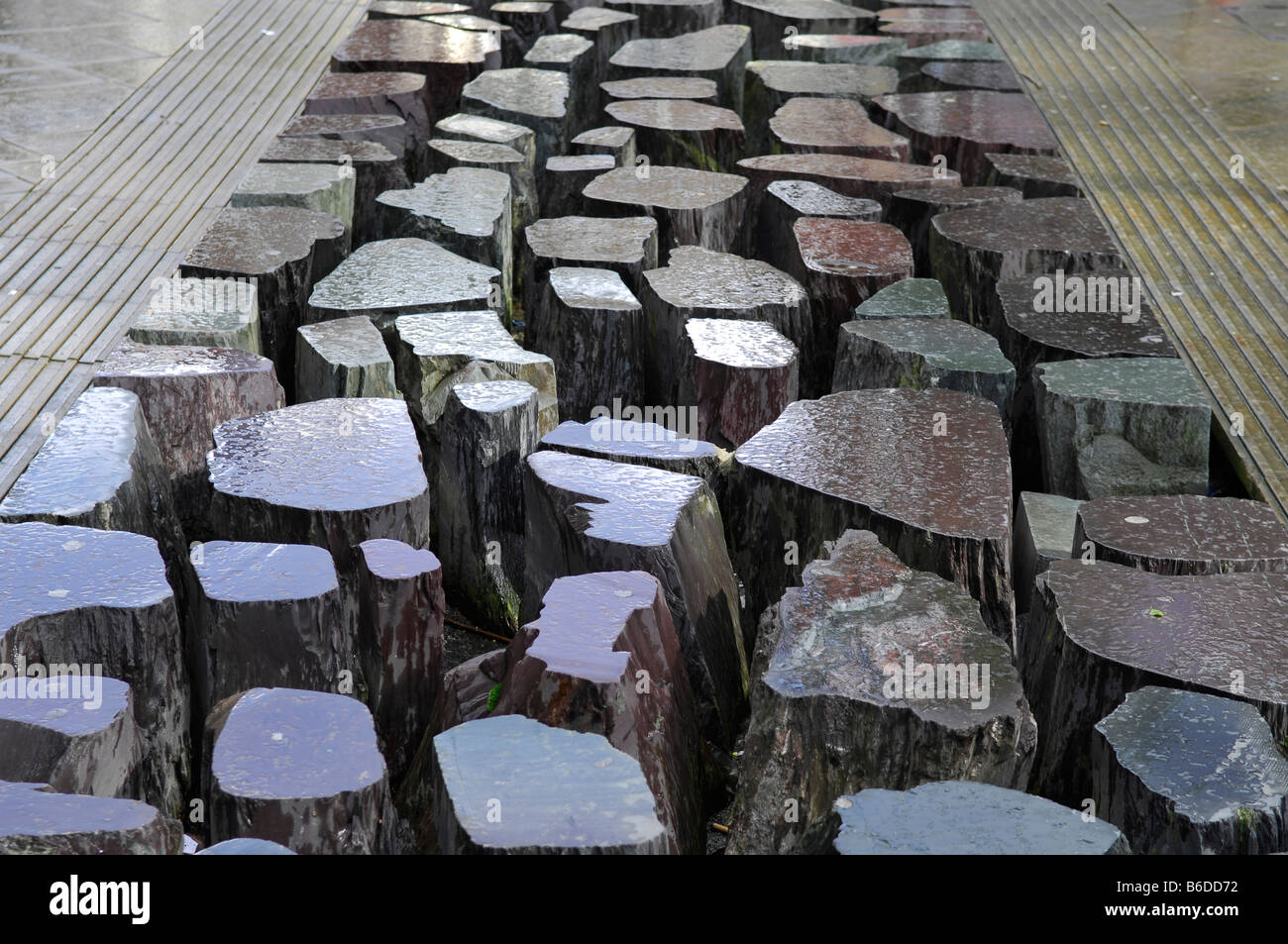 wet stones pebbles slate cobbles sculpture manchester millenium square ...