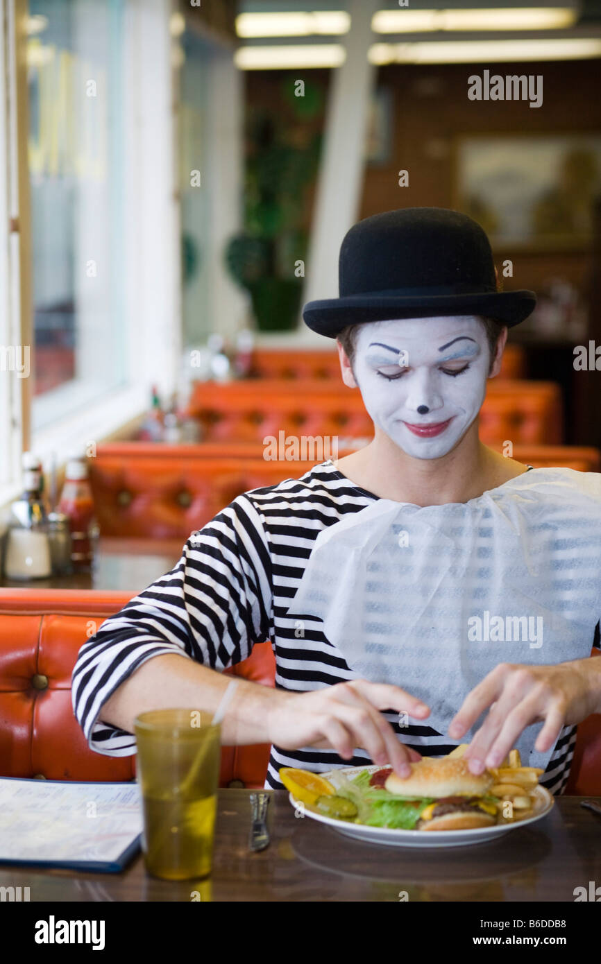 Young man, painted face, mime, smiling Stock Photo - Alamy