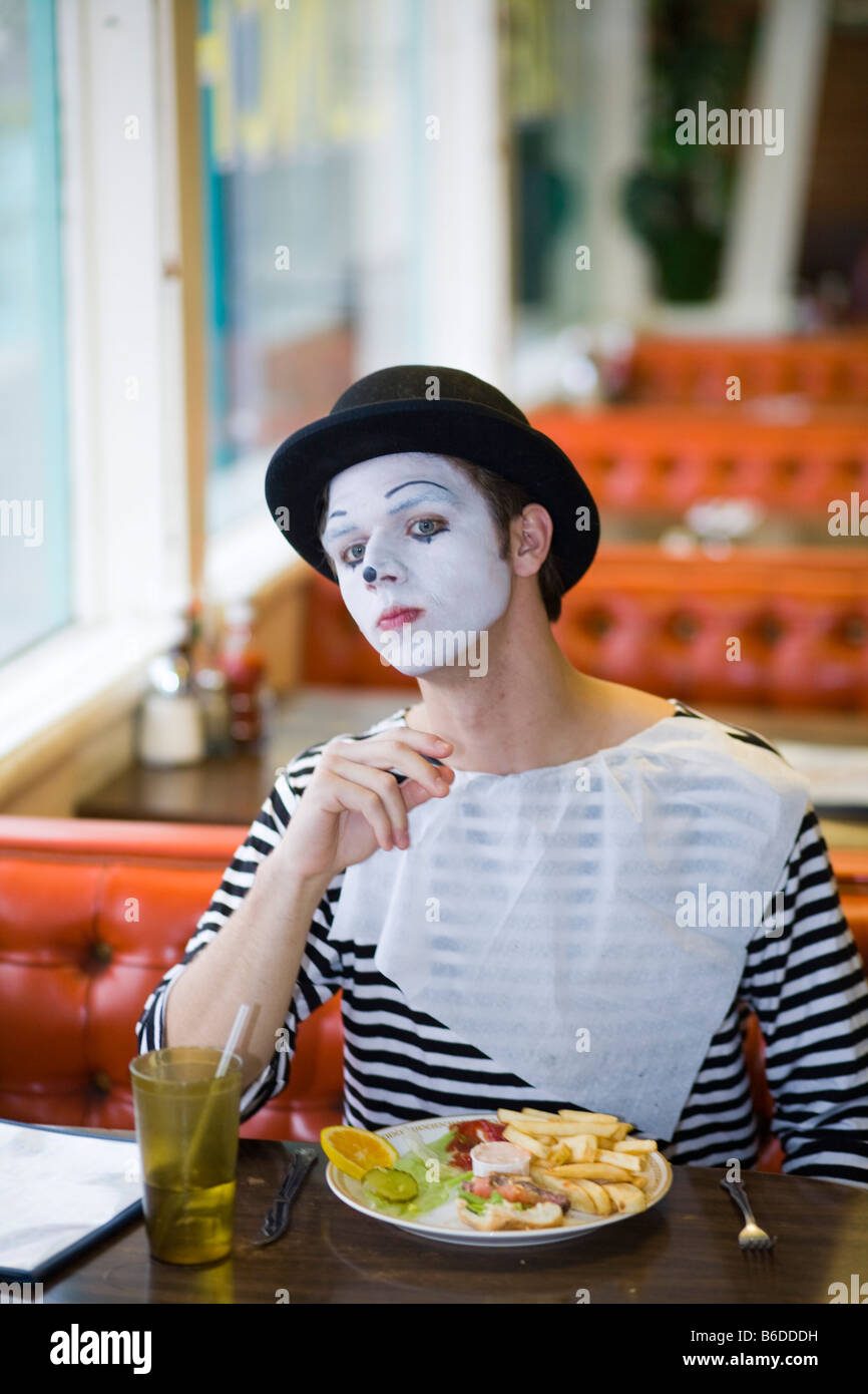 Young man, painted face, mime, smiling Stock Photo - Alamy