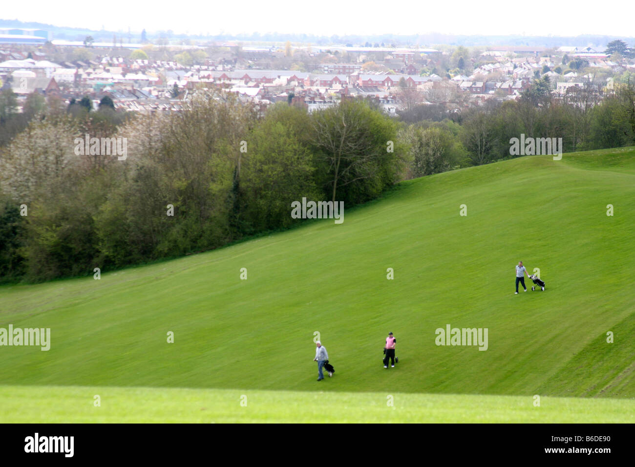 Golfers walking town hi-res stock photography and images - Alamy
