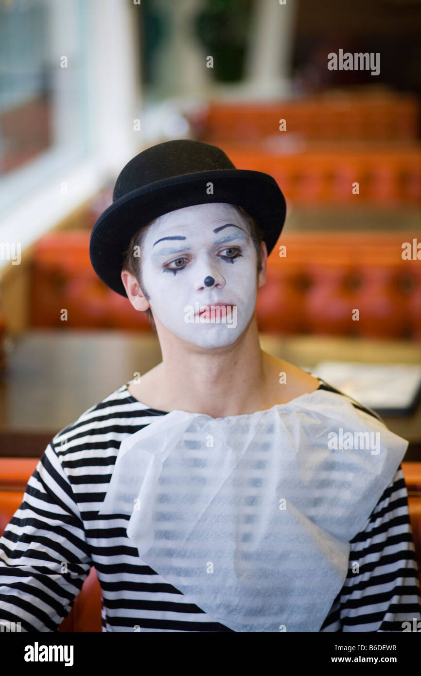 Young man, painted face, mime, smiling Stock Photo - Alamy