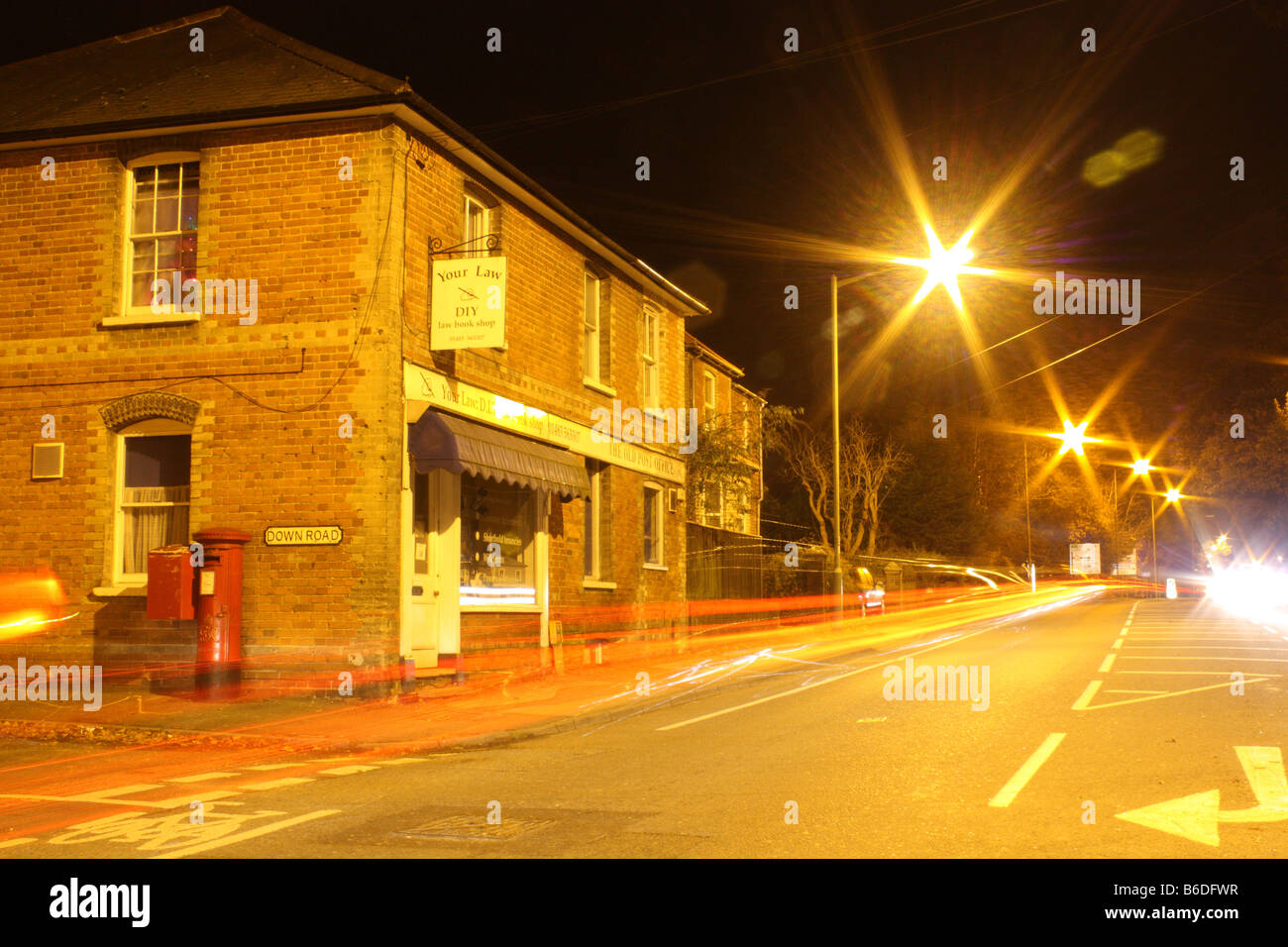 Corner Shop with Traffic Trails Stock Photo - Alamy