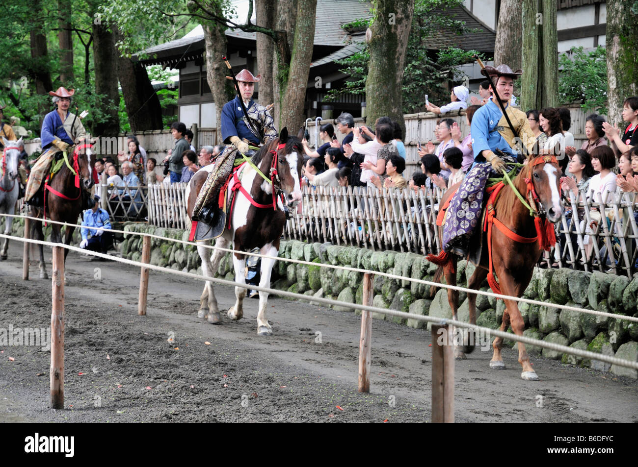 The archers parade on their horses before the horseback archery ...