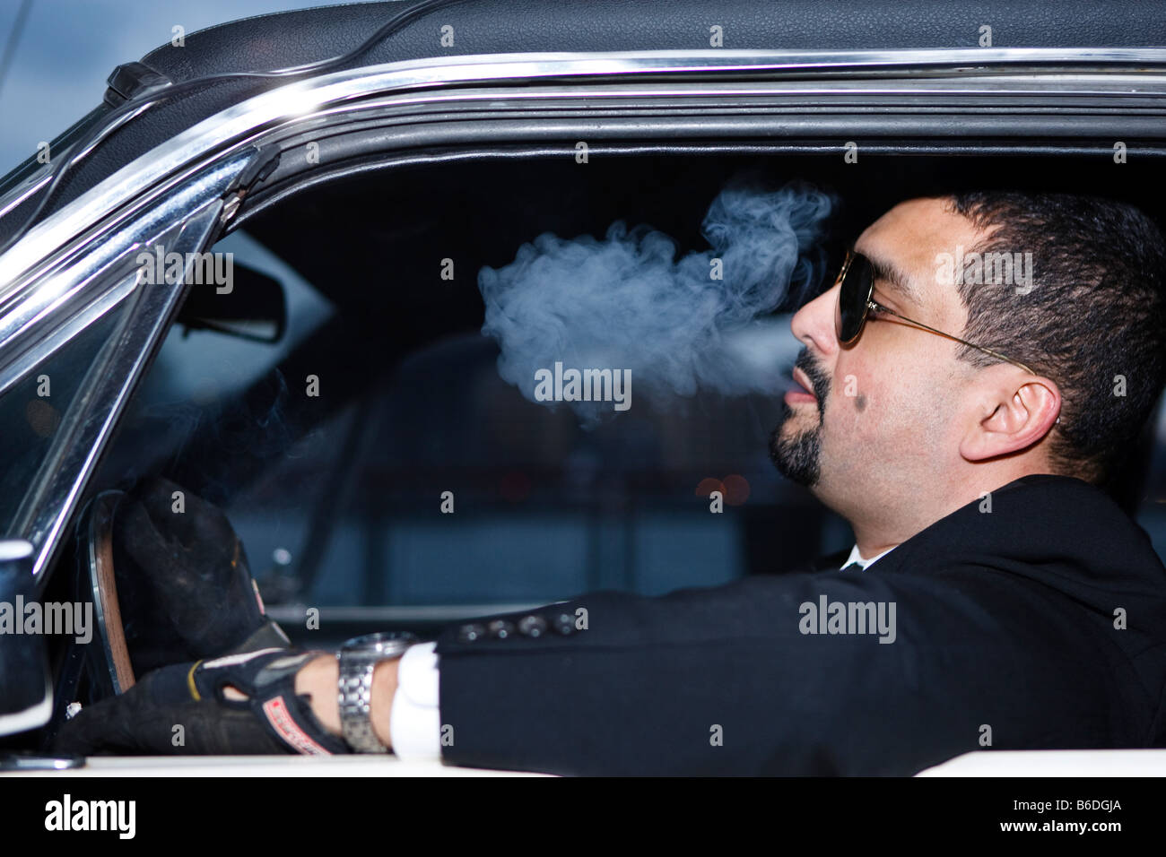 A man smokes in his car Stock Photo - Alamy