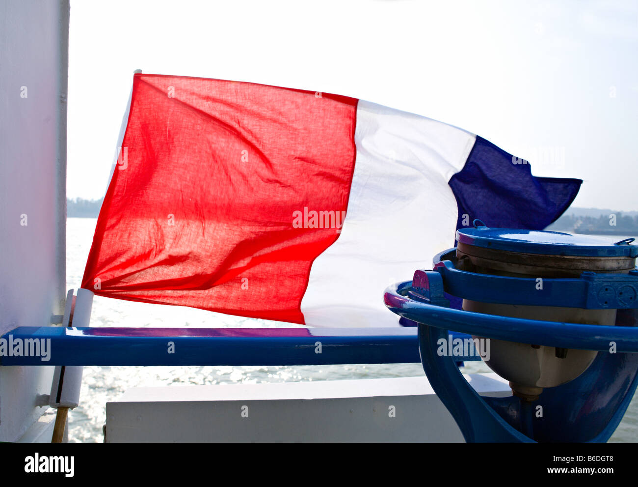 CHINA, YANGTZE RIVER: Bright tri color flag flies from a Yangtze River ...