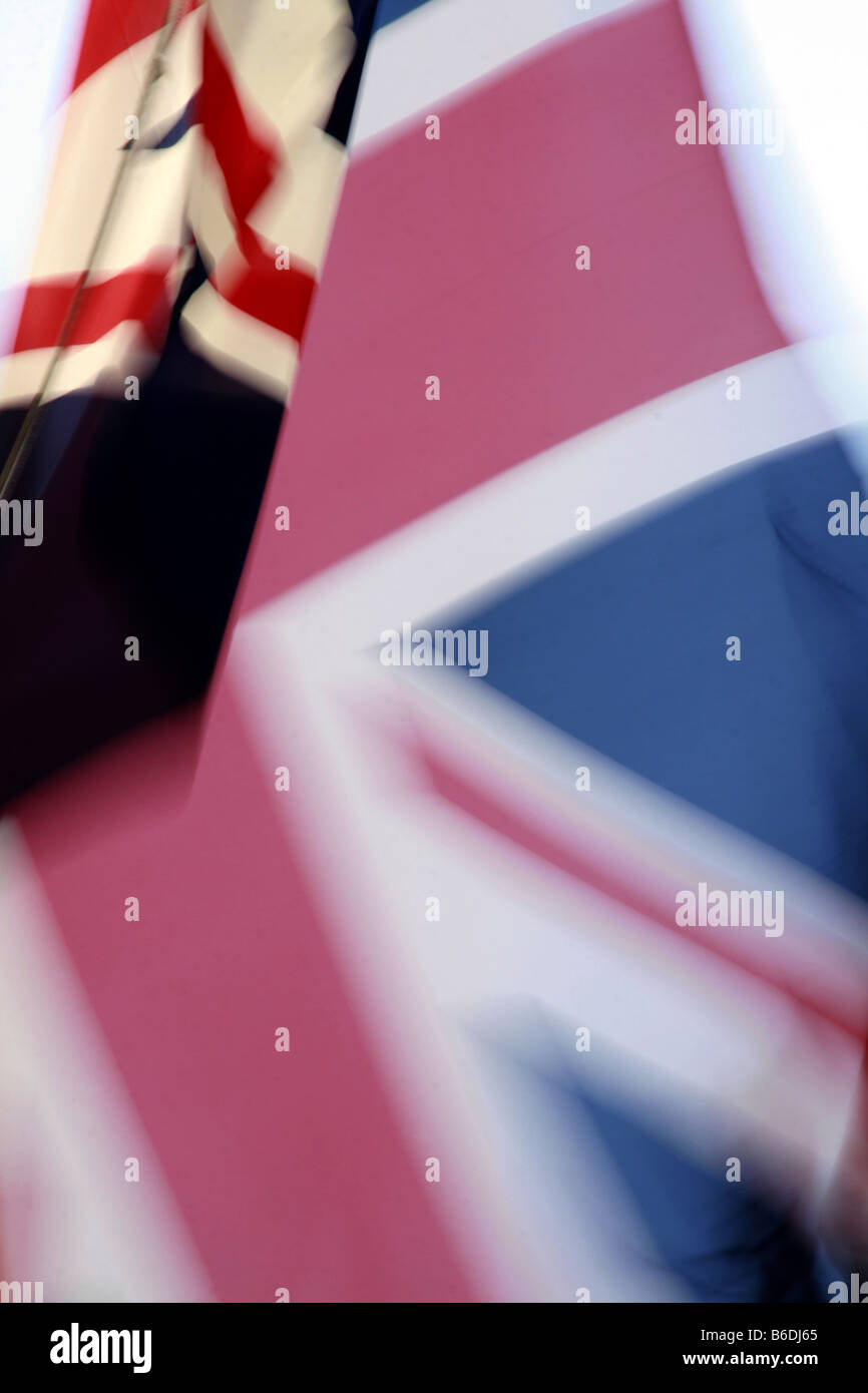 abstract union jack flag flying in wind in sun Stock Photo - Alamy