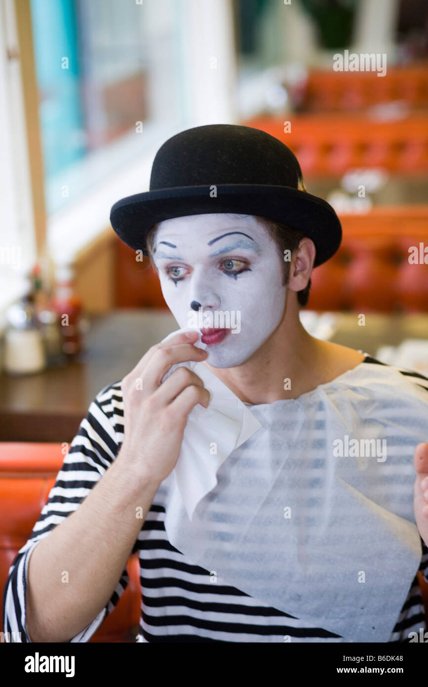 Young man, painted face, mime, smiling Stock Photo - Alamy