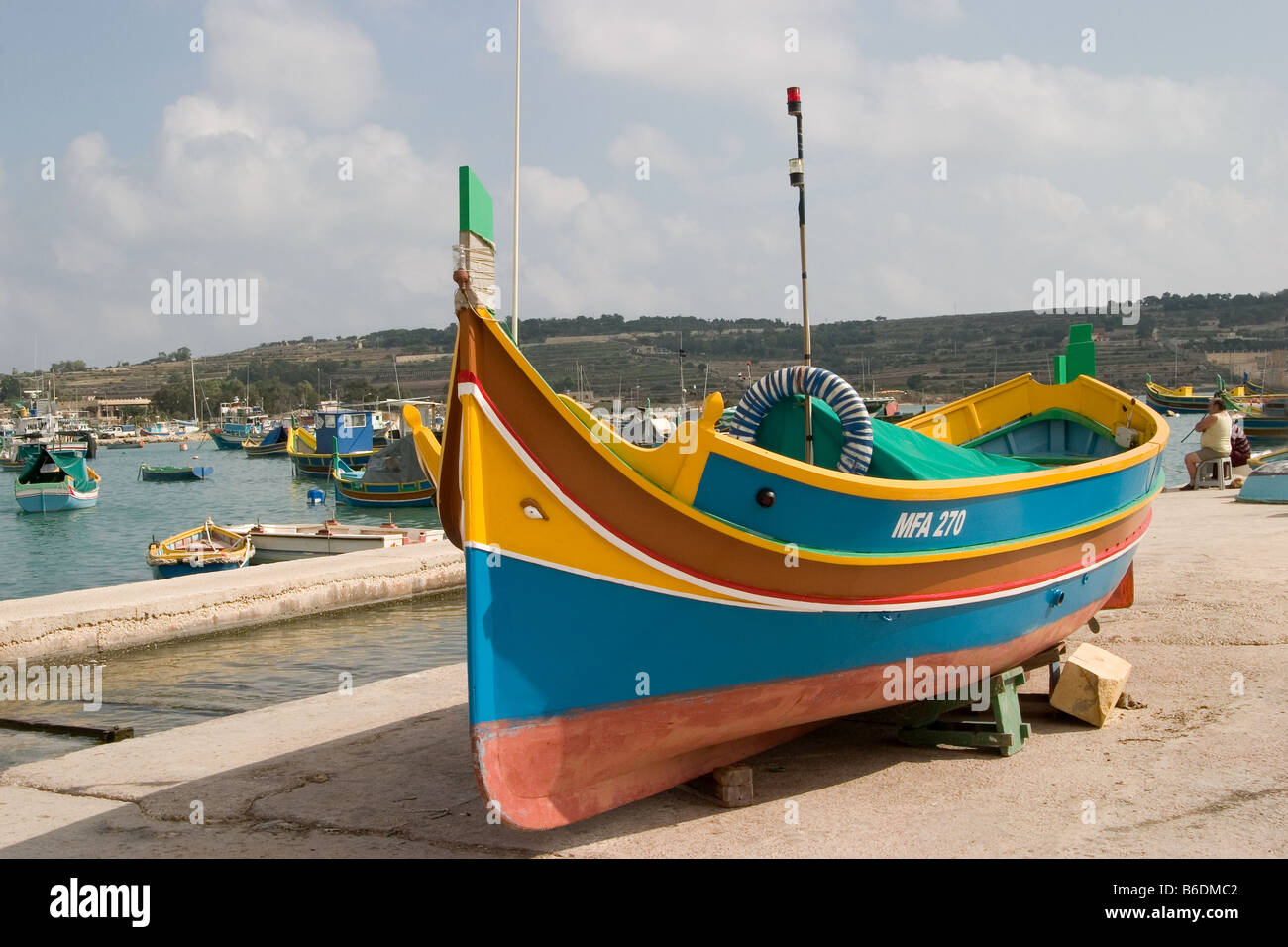 Luzzu traditional fishing boat on quayside at Marsaxlokk Bay Malta ...