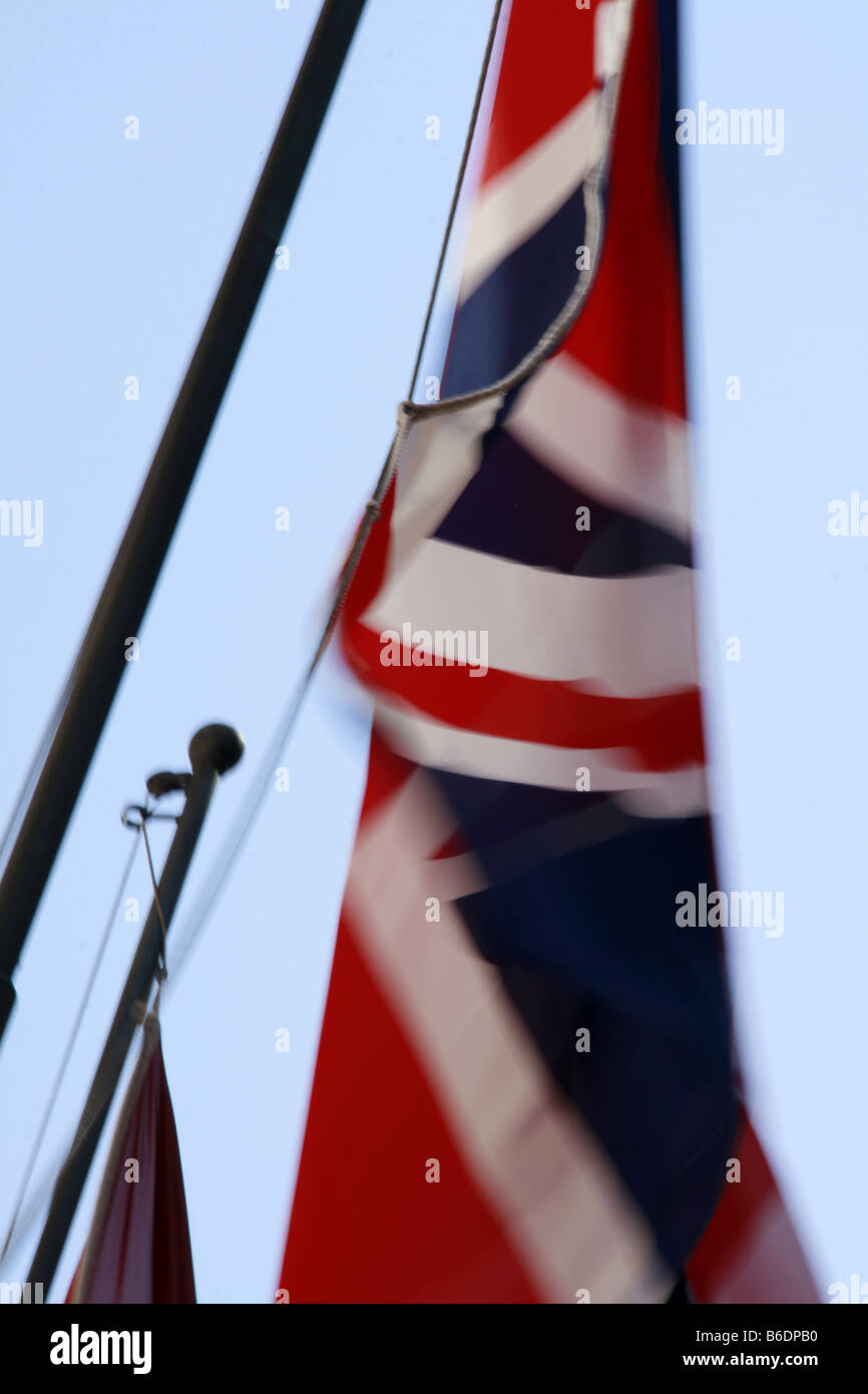 abstract union jack flag flying in wind in sun Stock Photo - Alamy