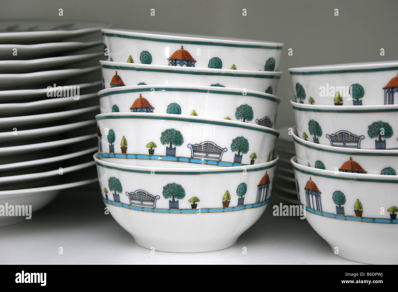 Stack of plates bowls and utensils hi-res stock photography and images ...