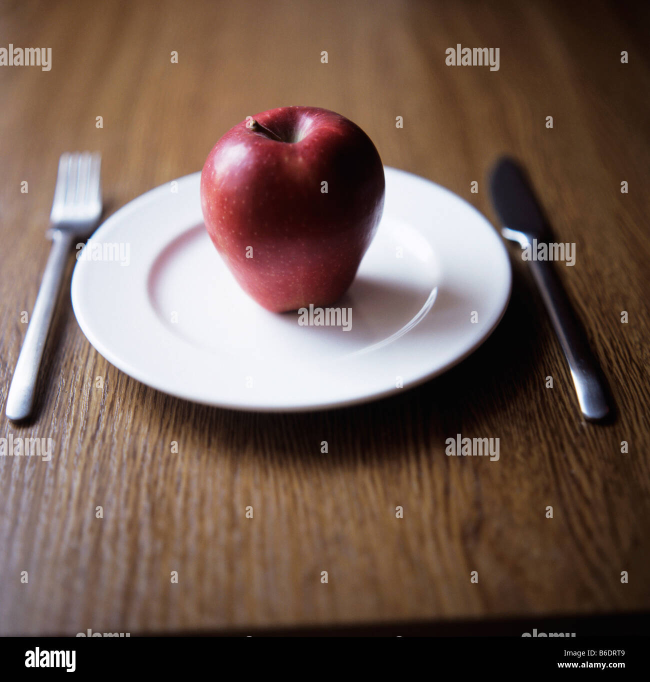 Apple on a plate. This image could be used to depict healthy eating or ...