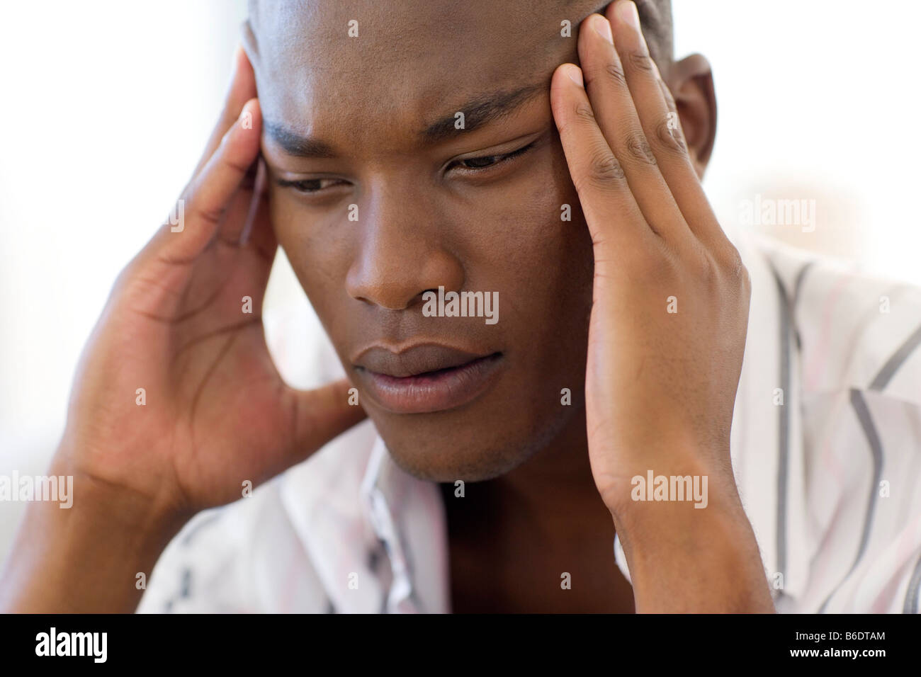 Fingers pressing head hi-res stock photography and images - Alamy