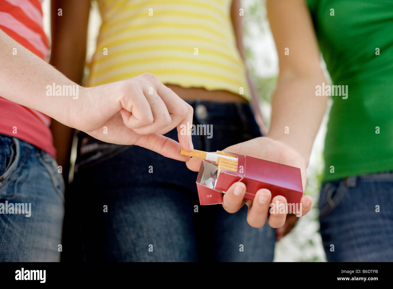 Girl offering friend cigarette High Resolution Stock Photography and ...