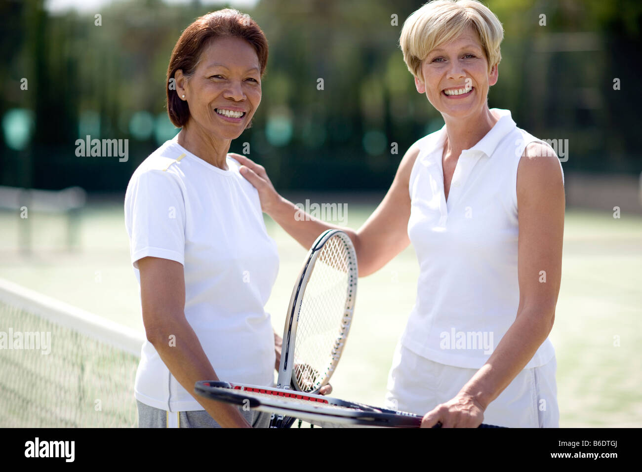 Tennis players. Two friends enjoying a game of tennis Stock Photo - Alamy