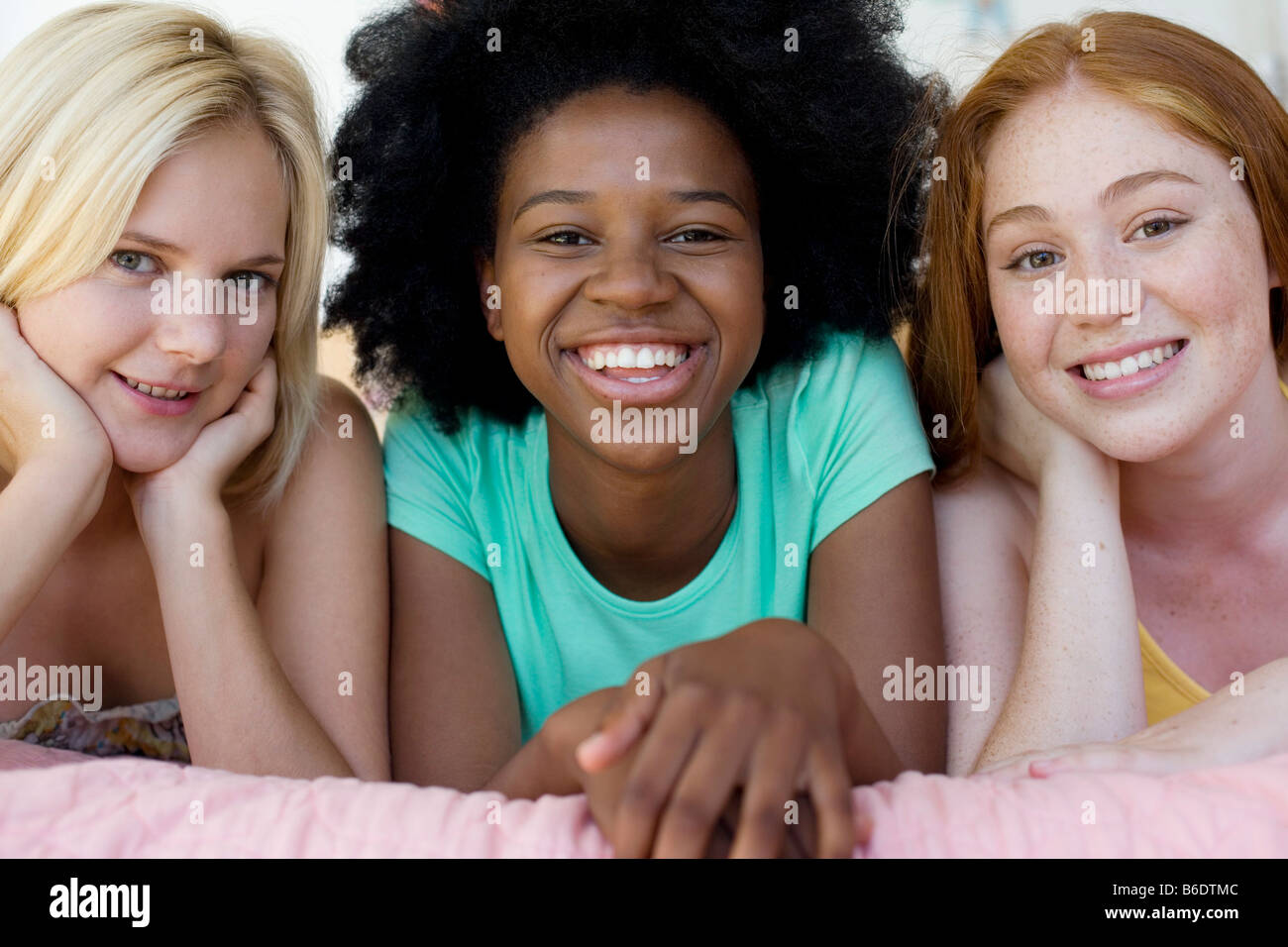 Teenage friends. Teenage girls relaxing and chatting together in a ...
