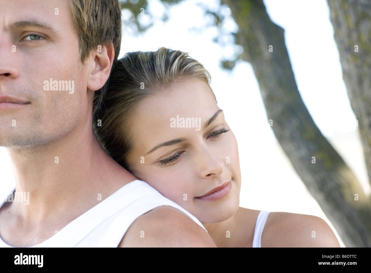 Couple. Woman resting her head on her partner's shoulder Stock Photo ...